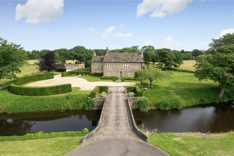 Inside fairy tale house in 'unexpected' Greater Manchester village with its own moat and huge lake