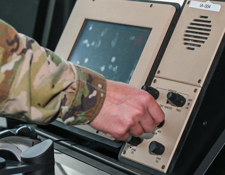 Senior airman stands watch to safely guide aircraft at Maxwell AFB