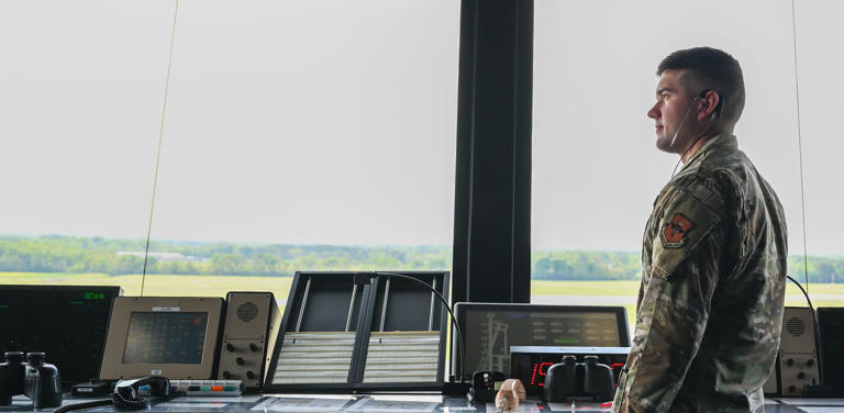 Senior airman stands watch to safely guide aircraft at Maxwell AFB