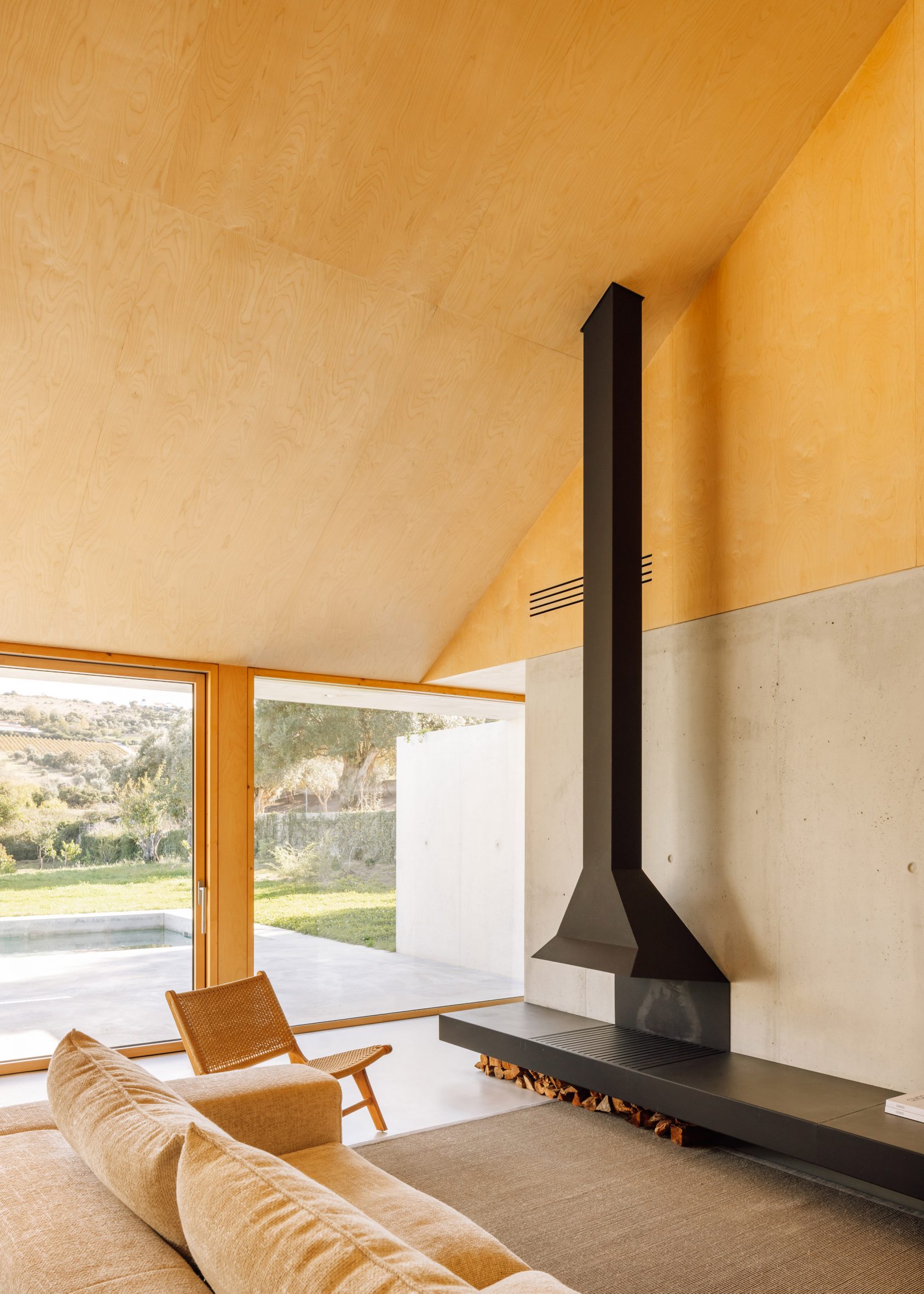 Eight living room interiors warmed by wood-clad ceilings