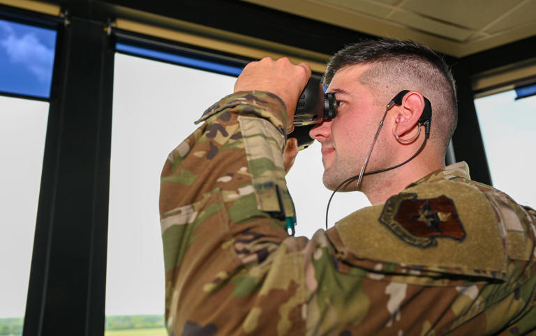 Senior airman stands watch to safely guide aircraft at Maxwell AFB