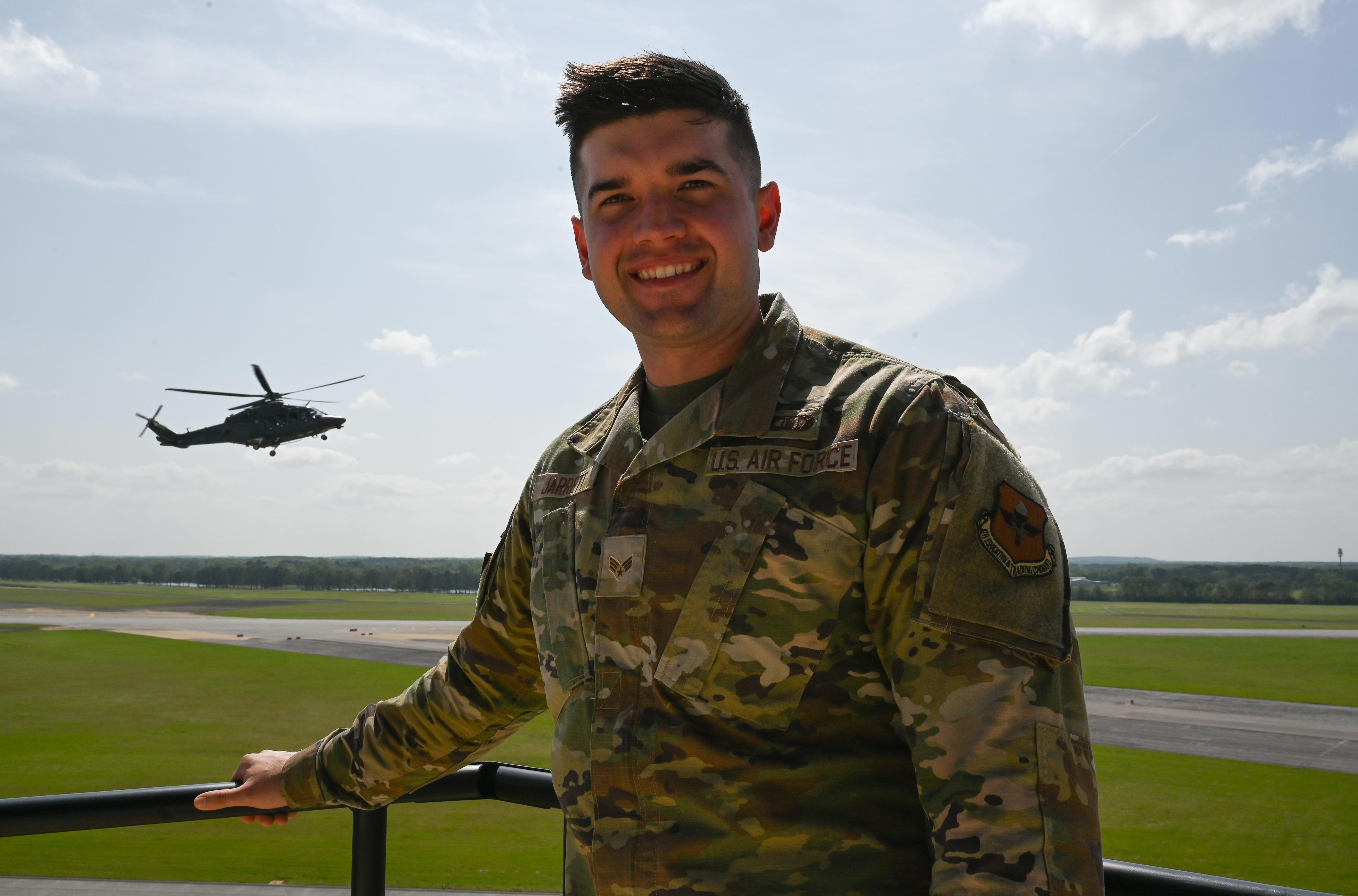 Senior airman stands watch to safely guide aircraft at Maxwell AFB