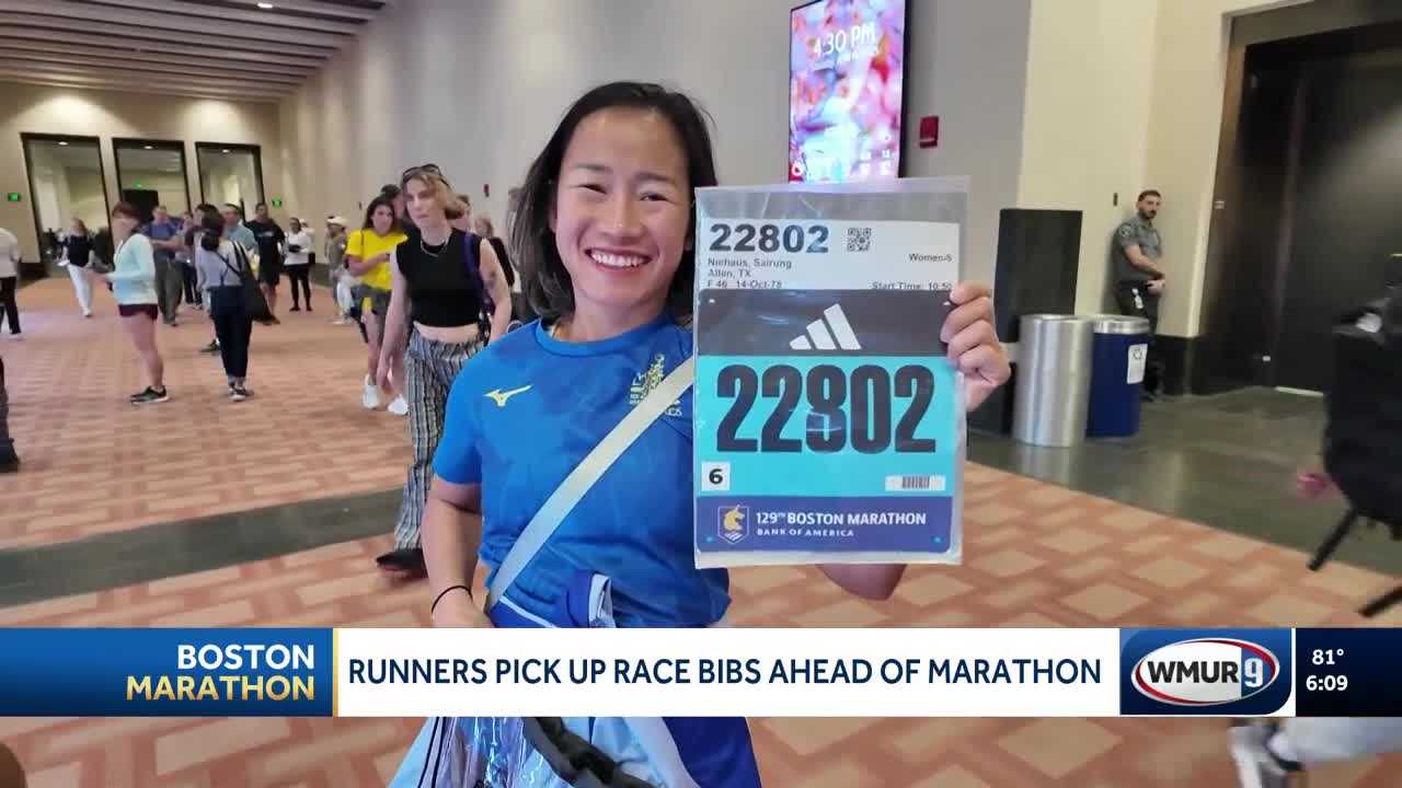 Runners pick up race bibs ahead of Monday's Boston Marathon
