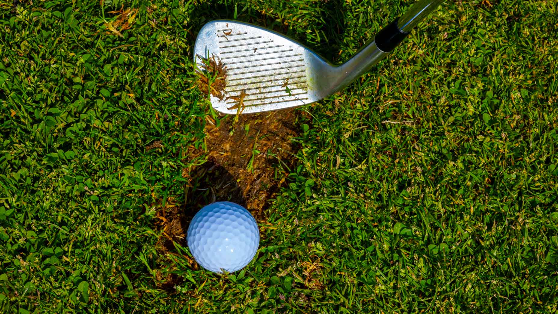 Use this technique to easily hit a wedge when your ball is in a divot