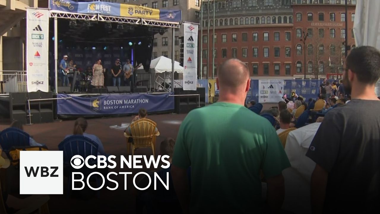 Spectators and runners gather for the Boston Marathon fan expo at city hall