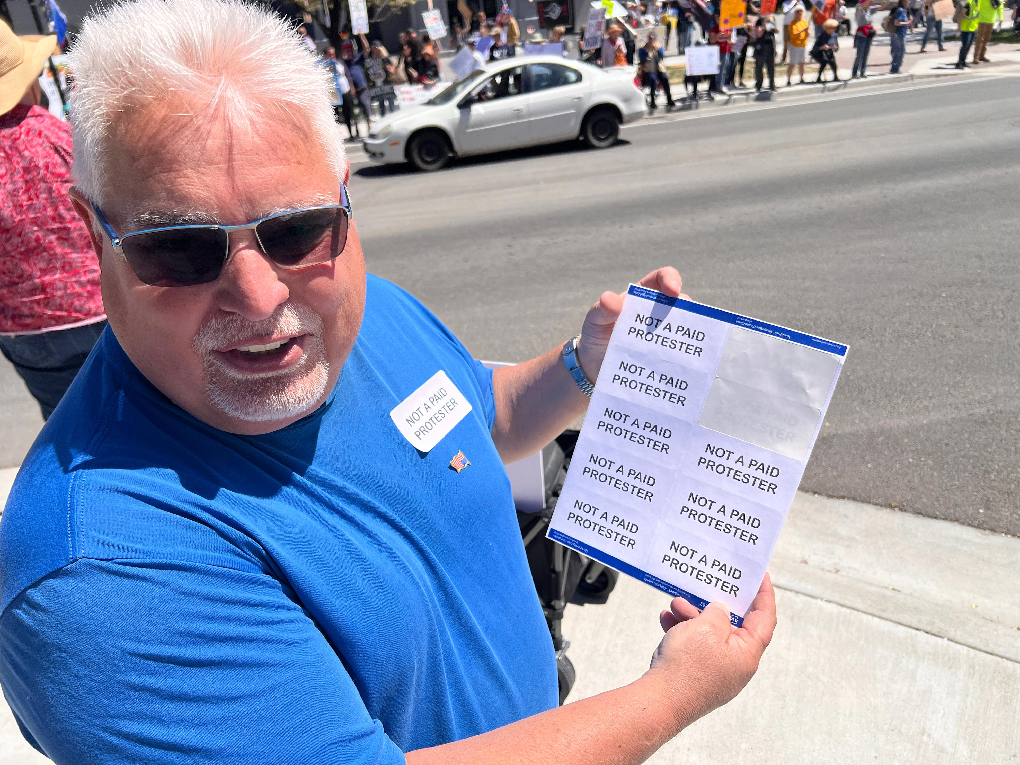 Protesters turn anger toward Nevada governor during anti-Trump rally