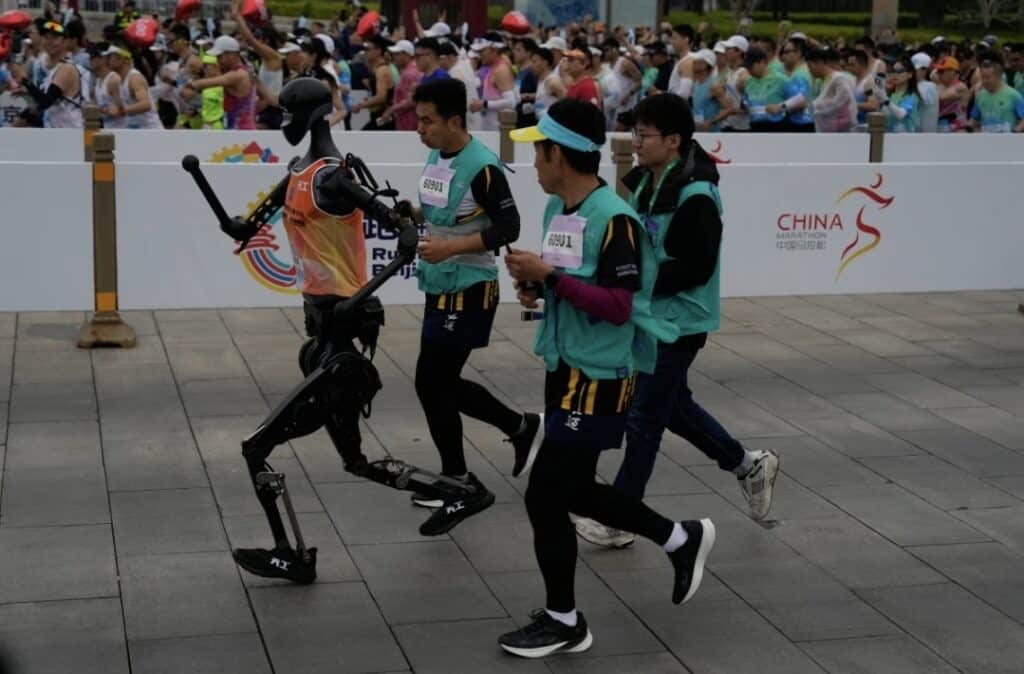 Humanoid robots run a half-marathon in Beijing alongside flesh-and ...