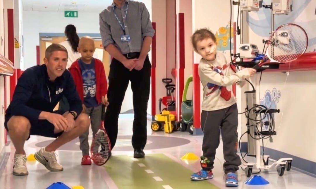 Big-hearted tennis coach coaxing kids back to health