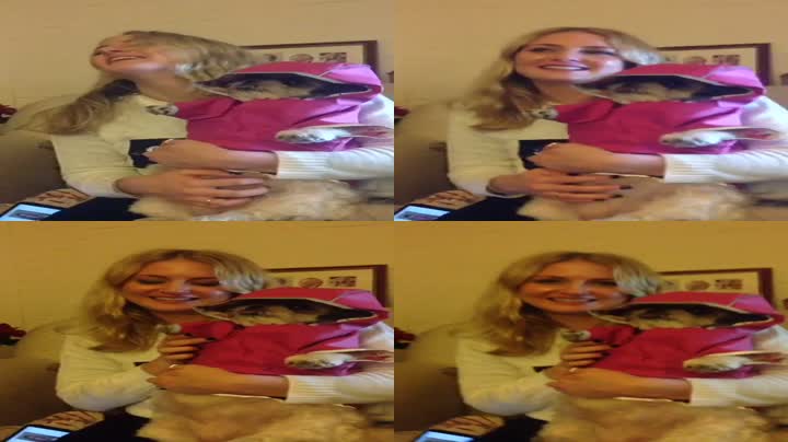 Still Pup in Jacket Waves for the Camera Shot