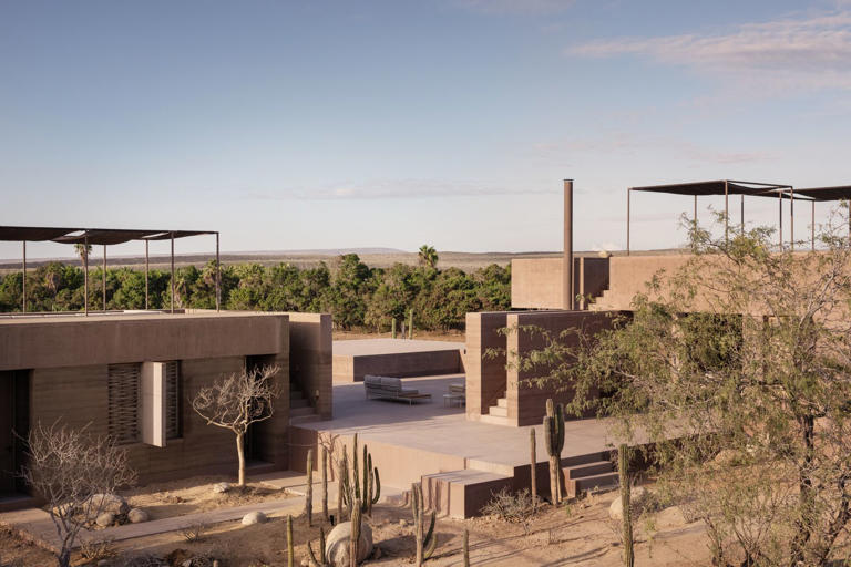 A Dusty-Pink Rammed Earth Home Appears to Rise Out of the Baja Desert