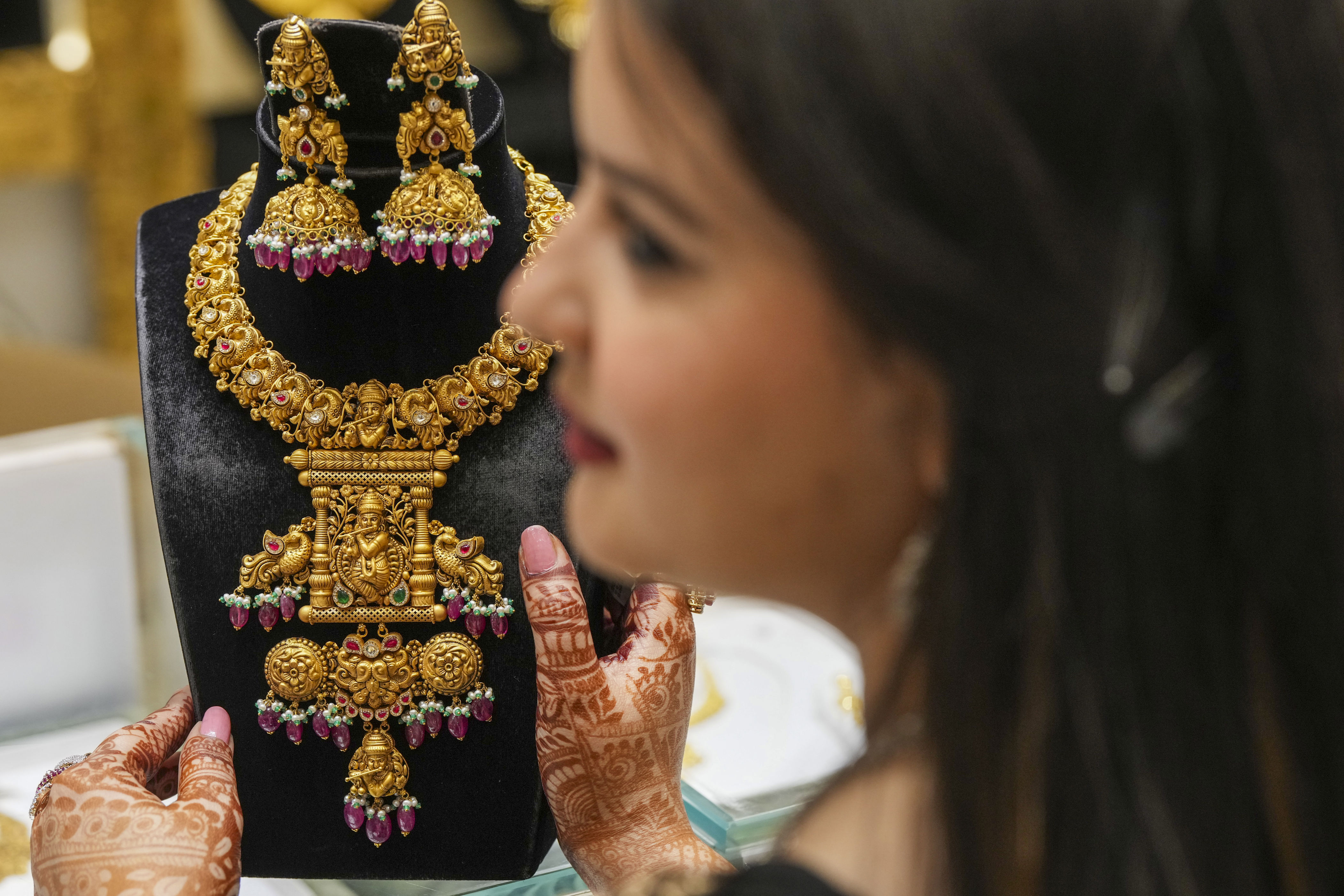 Gold, silver decline from record peaks on profit booking as Fed Chair ...