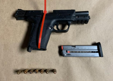 RPD: Man throws glass bottle, arrested with gun at Goodman Plaza