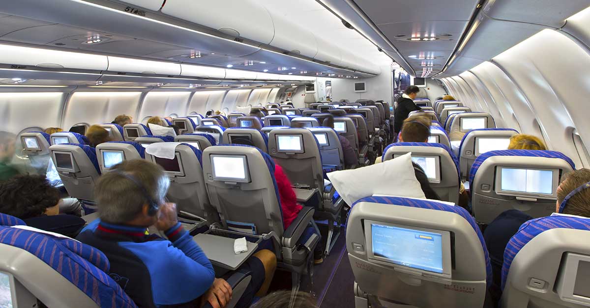 Couple escorted off plane by police after ordering Pringles, Coke and ...