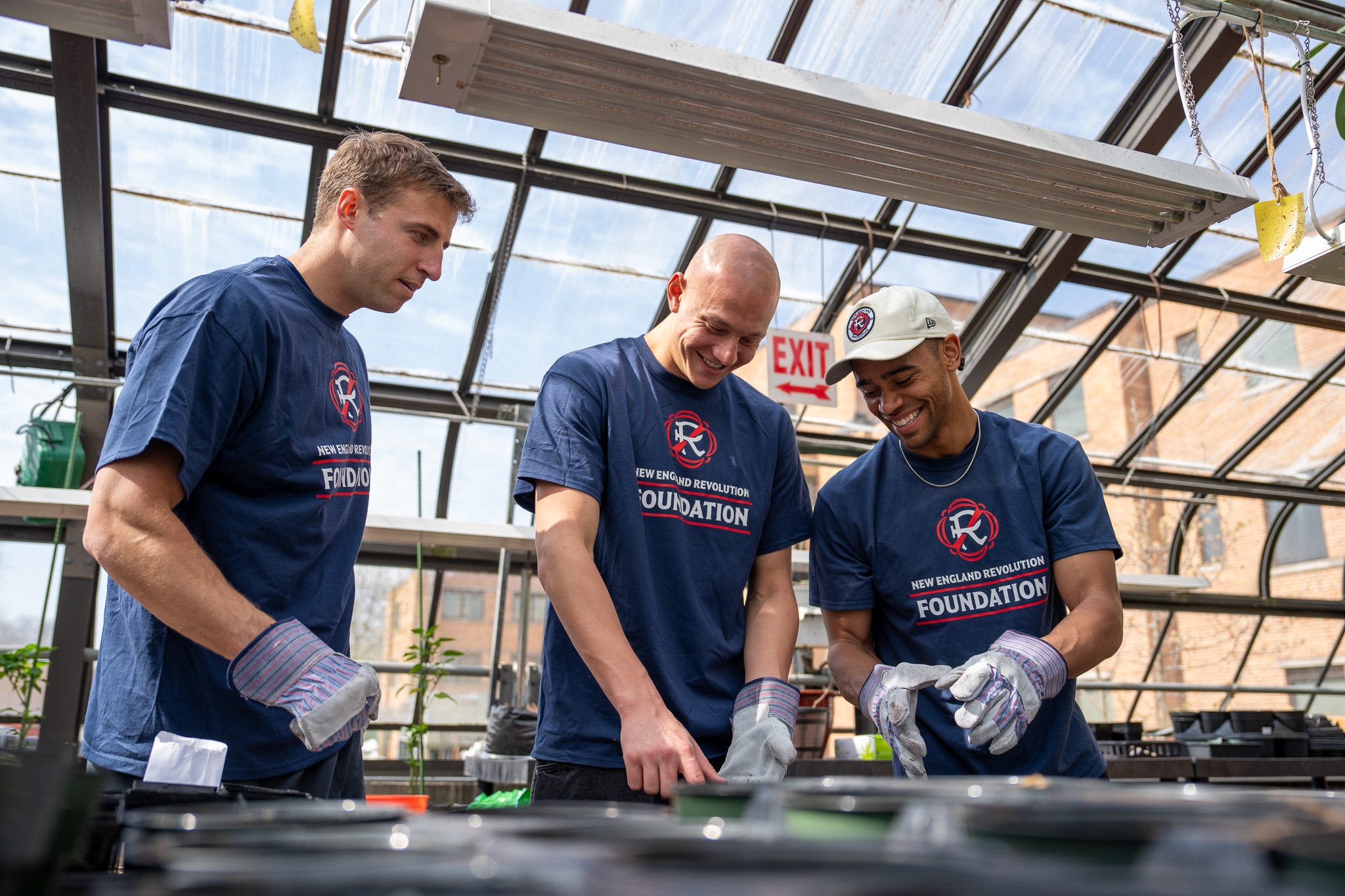 See New England Revolution players in action volunteering in Brockton