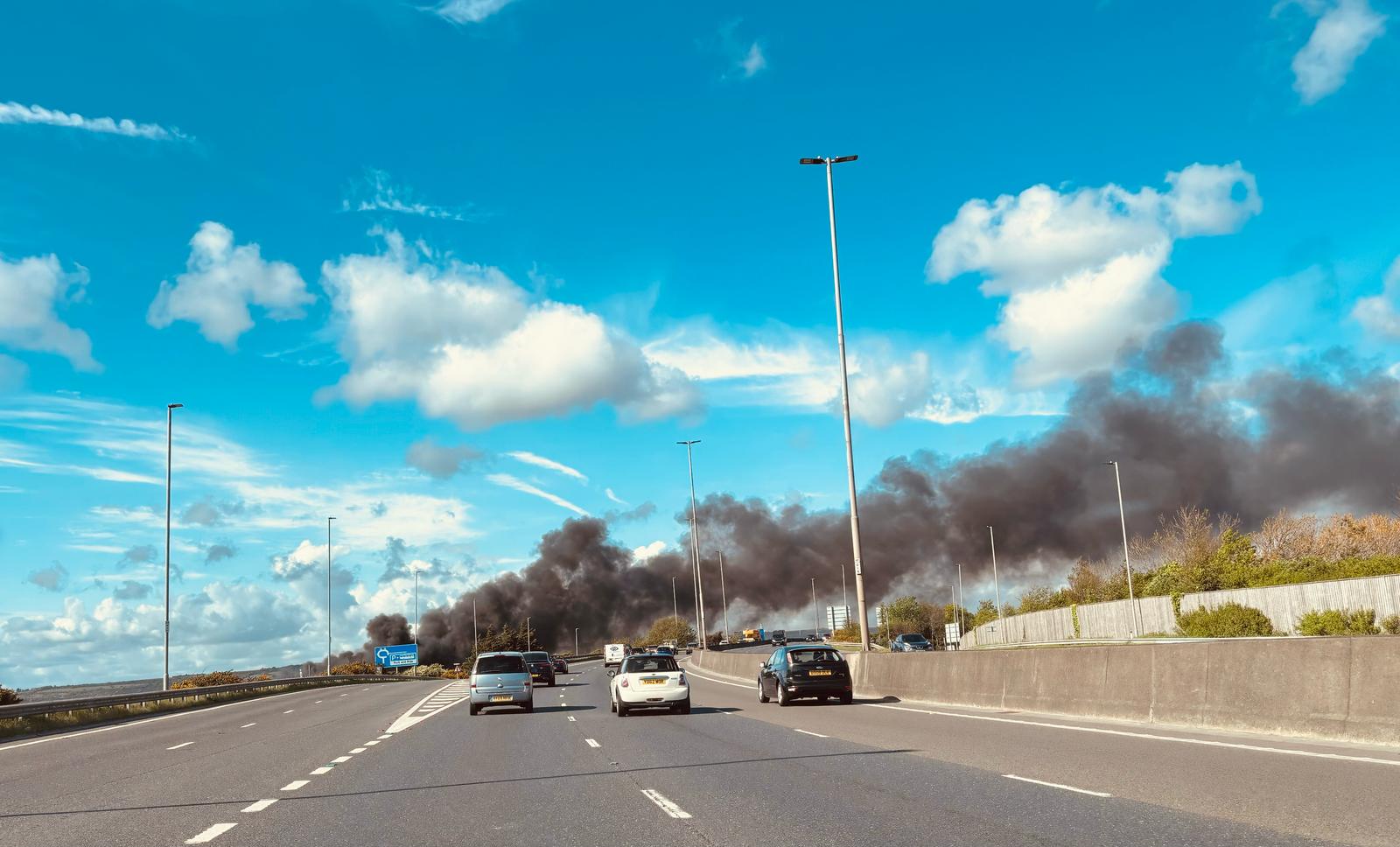 Black smoke rises over the M275 by Tipner as fire crews rush to the ...