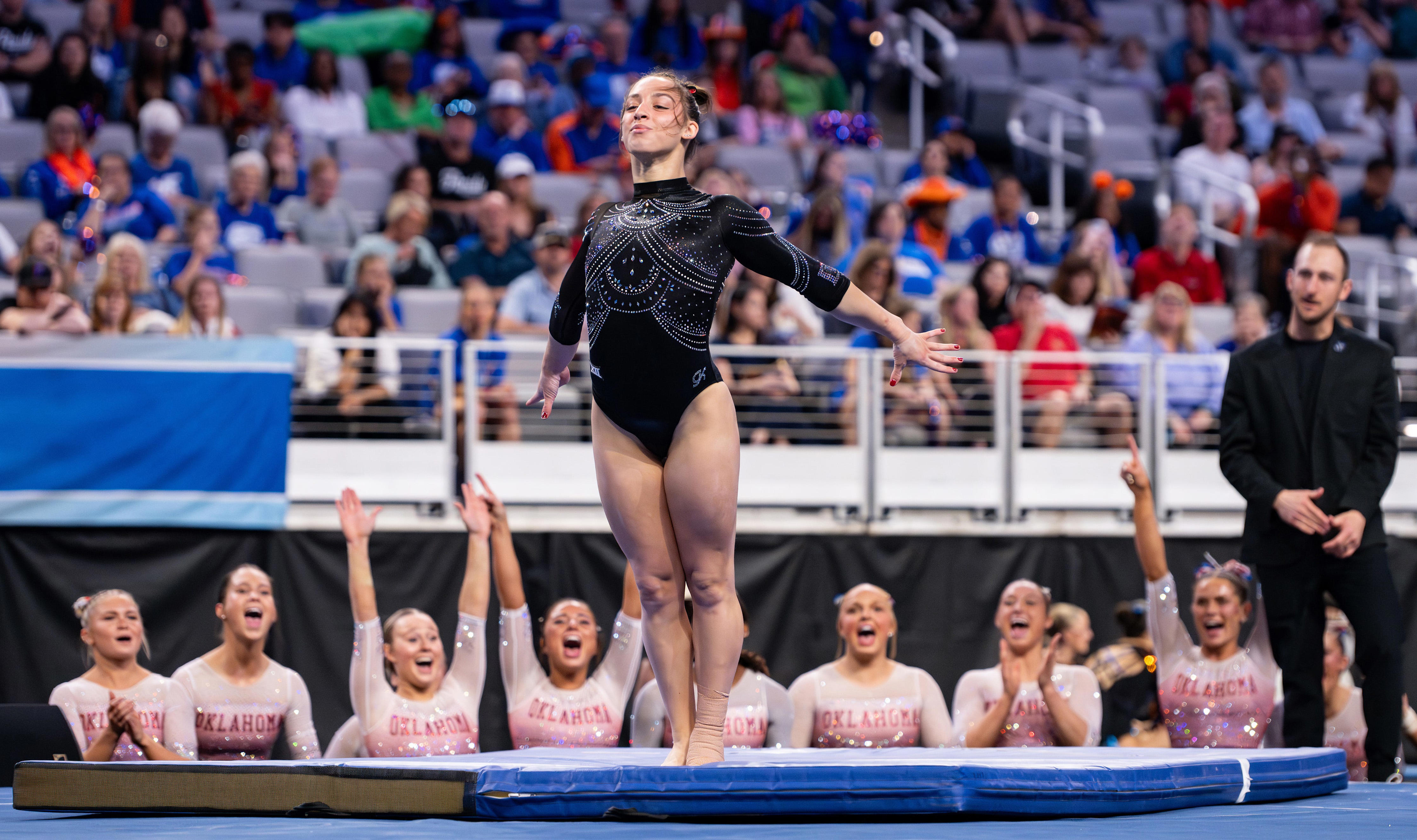 Oklahoma gymnasts cheer for Denver's Madison Ulrich at NCAA Championships