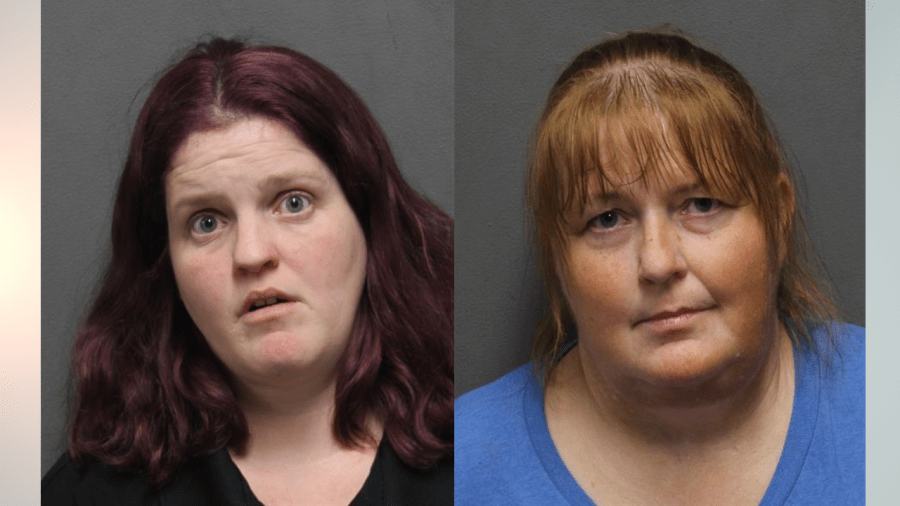 Two women accused of restraining malnourished child to bed