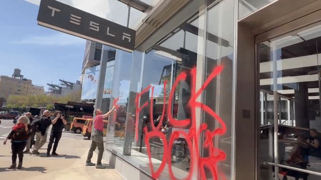 Activists Deface Tesla Showroom With Spray Paint on Earth Day