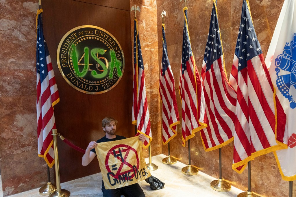 Climate protester arrested after spray painting over presidential ...