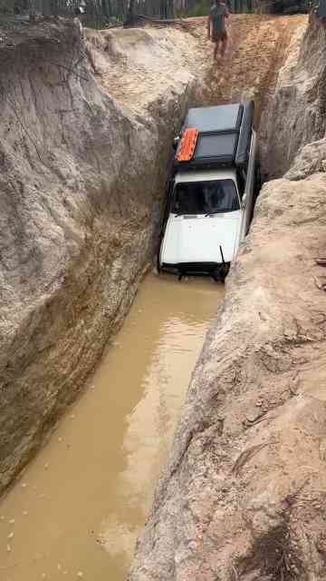 Off-Road Adventure Through a Narrow Muddy Trench