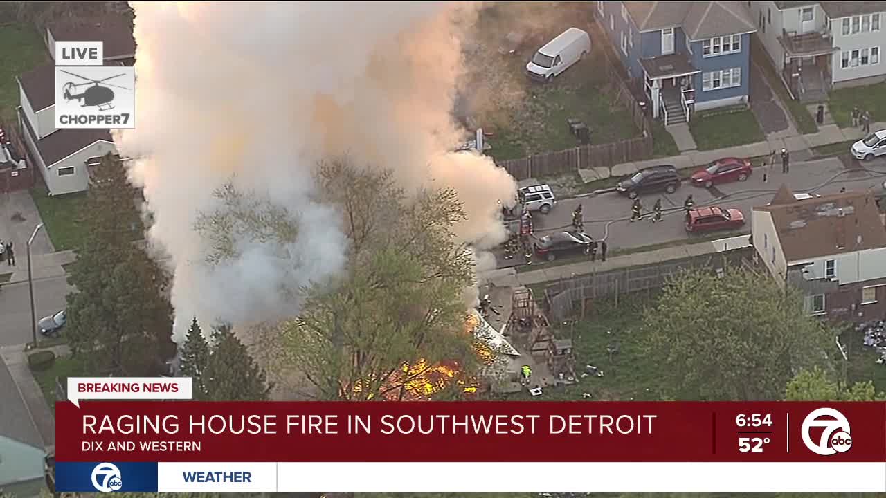 Crews battle raging house fire in Southwest Detroit