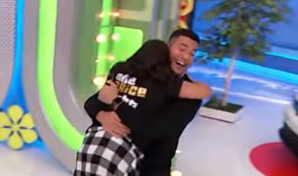 Price Is Right player jumps on model after winning on difficult game