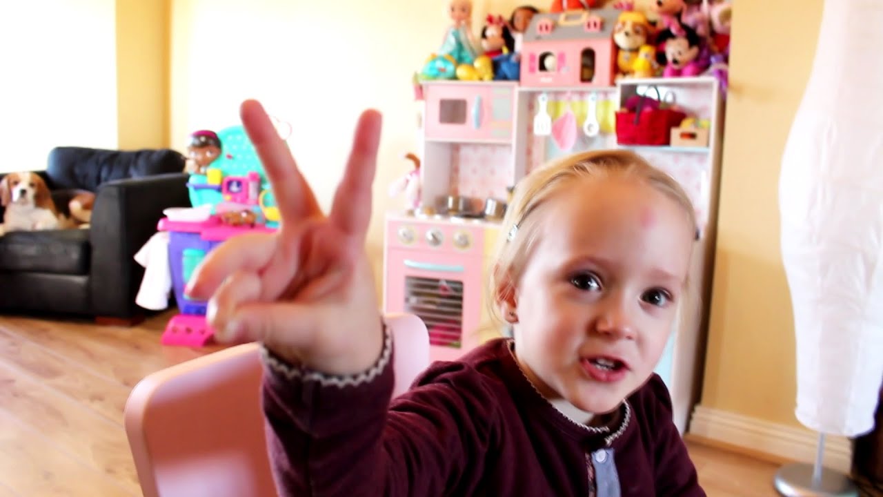 Girl loves having fun with Petcube camera for dog