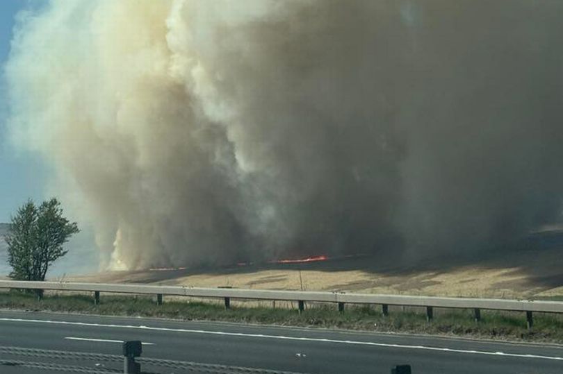 M62 Moor fire 'still spreading' as roads shut with 18 fire crews ...