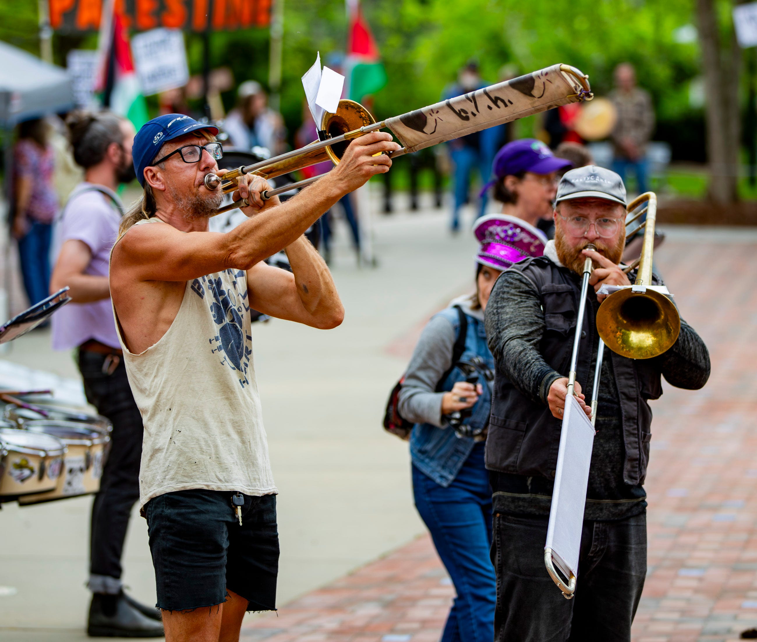 'Democracy dies in silence:' Hundreds rally against Trump policies at ...