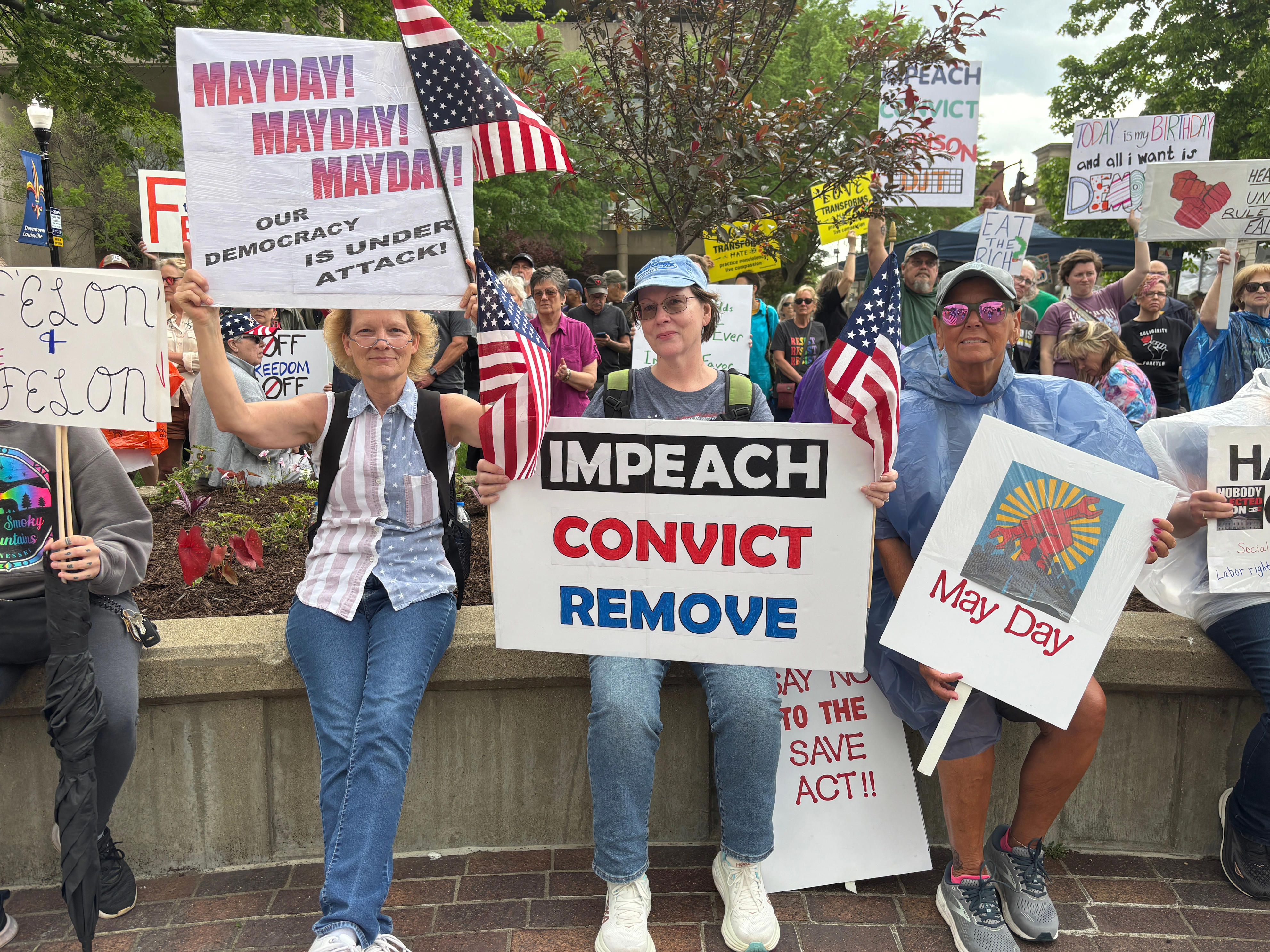 'We all need to be out here': Hundreds rally against Trump at ...
