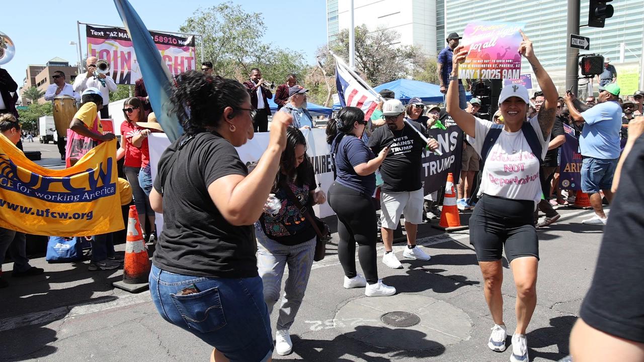 Rally goers dance to the live band Banda La Tremenda for the May Day ...