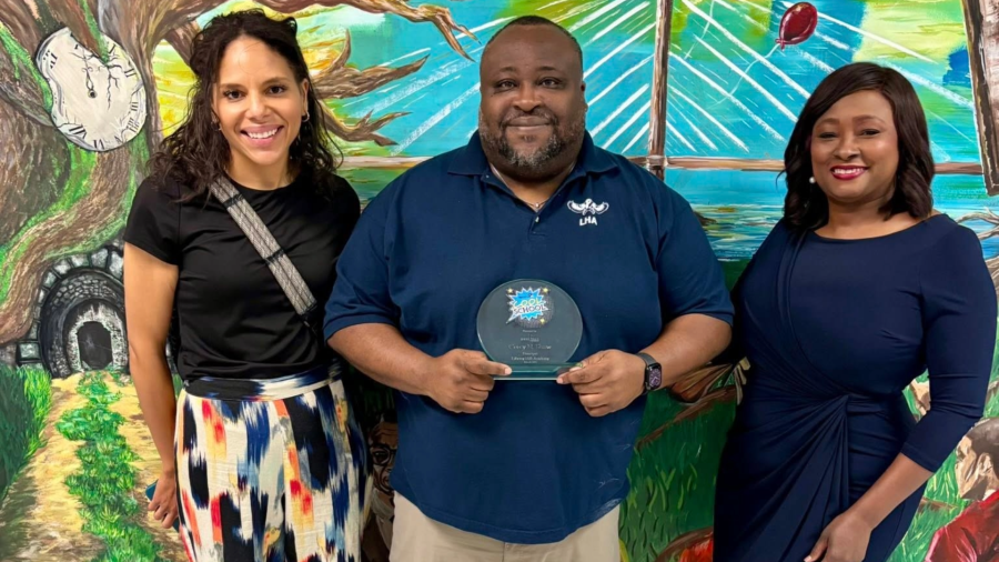 Principal Corey Shaw receives the Cool School Principal Award