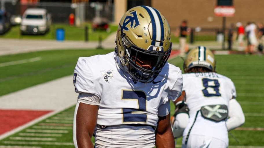 West Virginia in Battle with Heated Rivals for 1,300-Yard Rusher