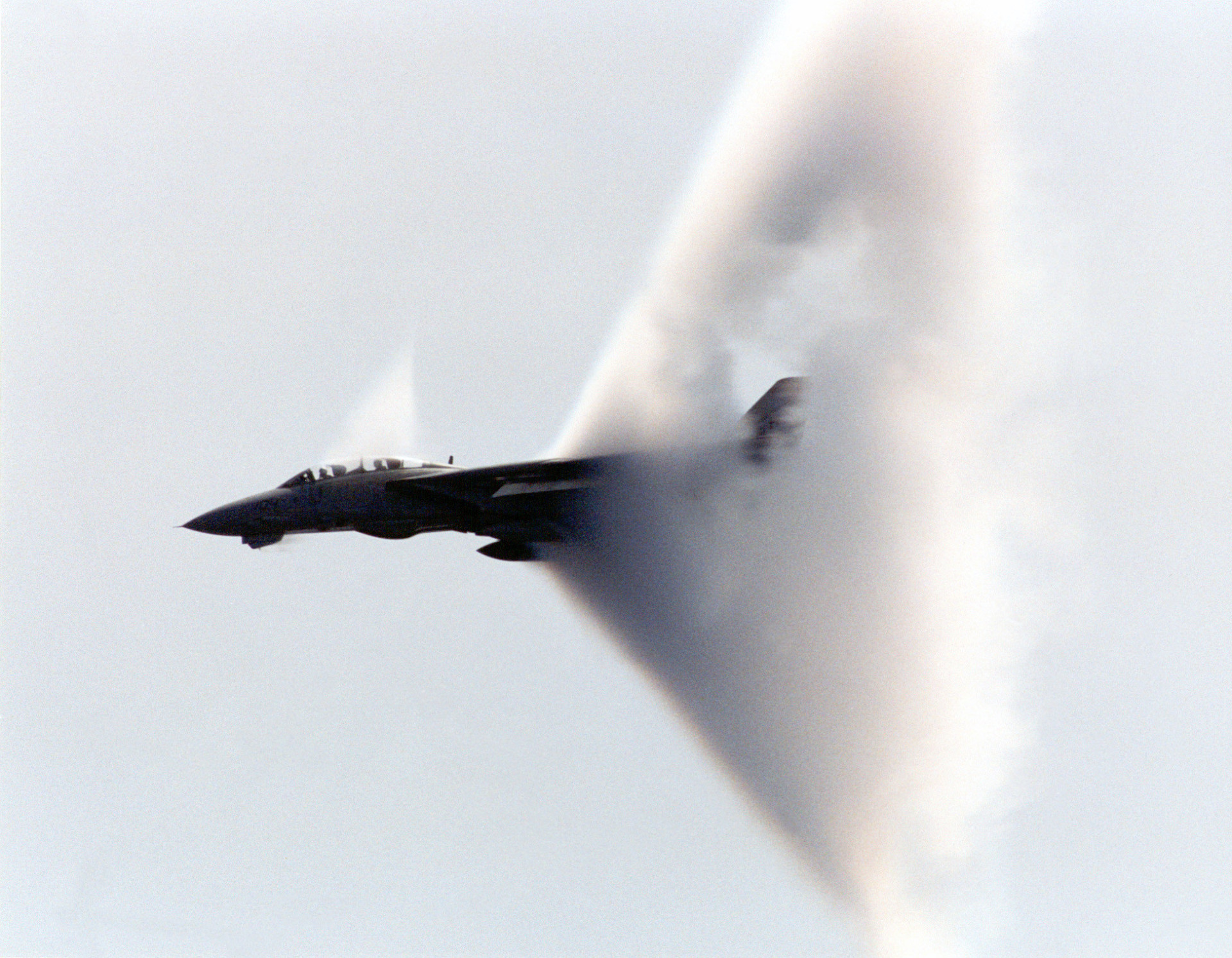 What is the sound barrier, and how is it broken?