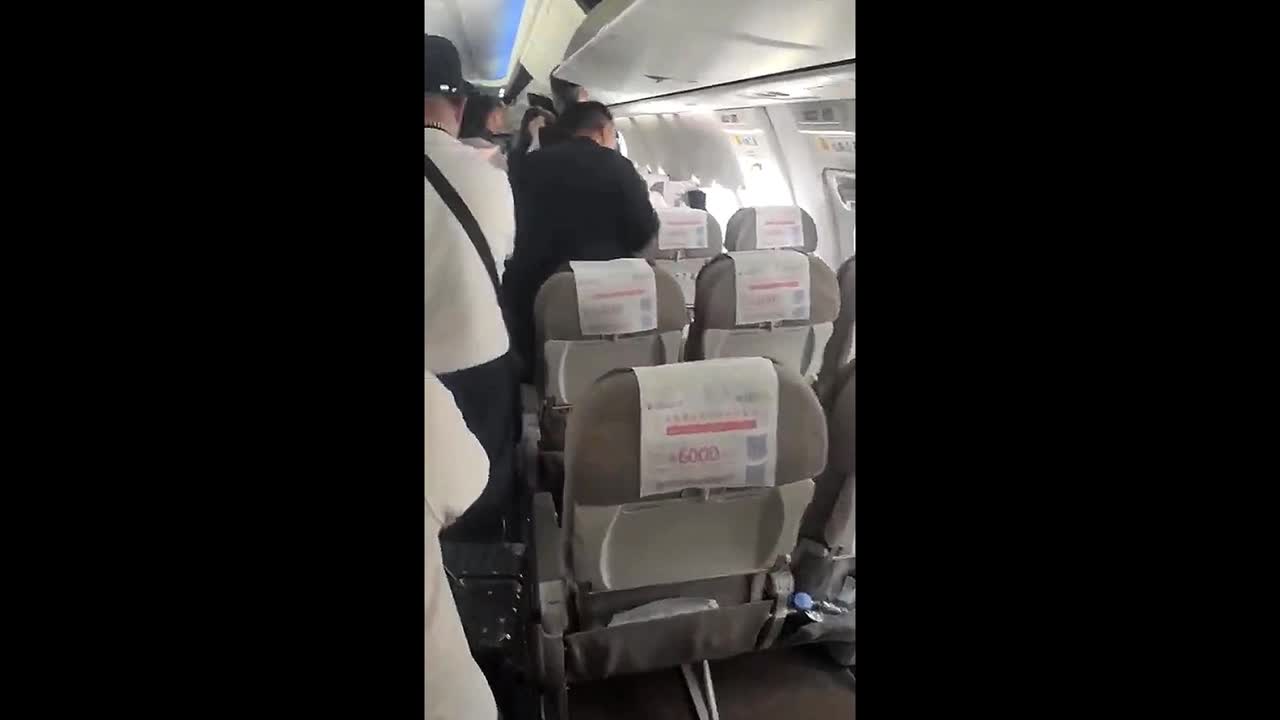 Passenger arrested after opening emergency exit as plane landed in ...