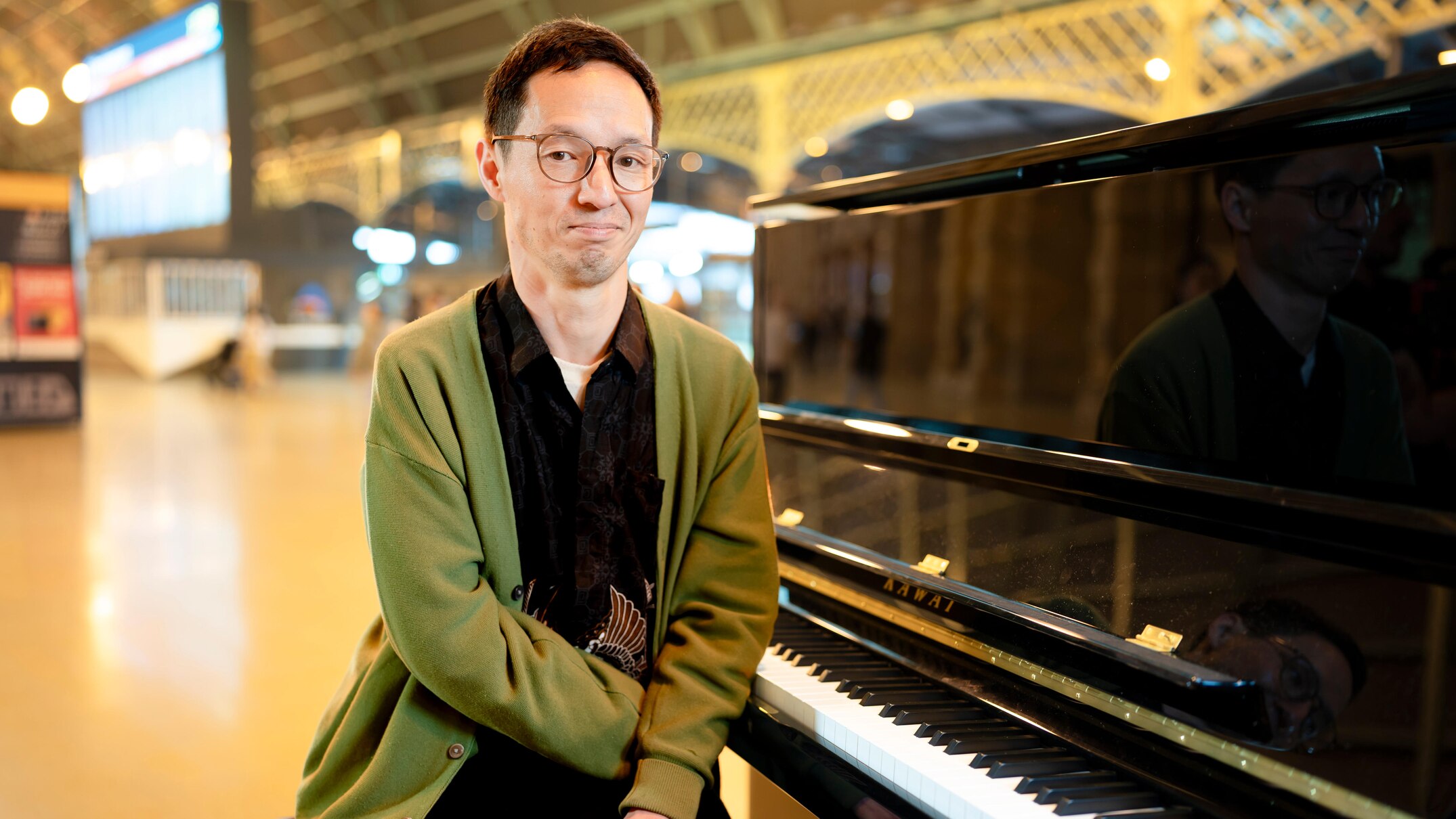 DJ plays the piano with one hand. There's a catalogue of music for one ...