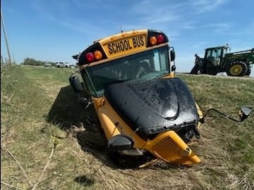 Eight children injured after school bus collides with tractor in RM of Grey