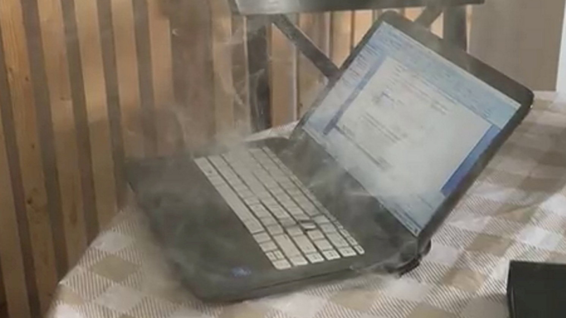Terrifying moment laptop spontaneously catches fire at home
