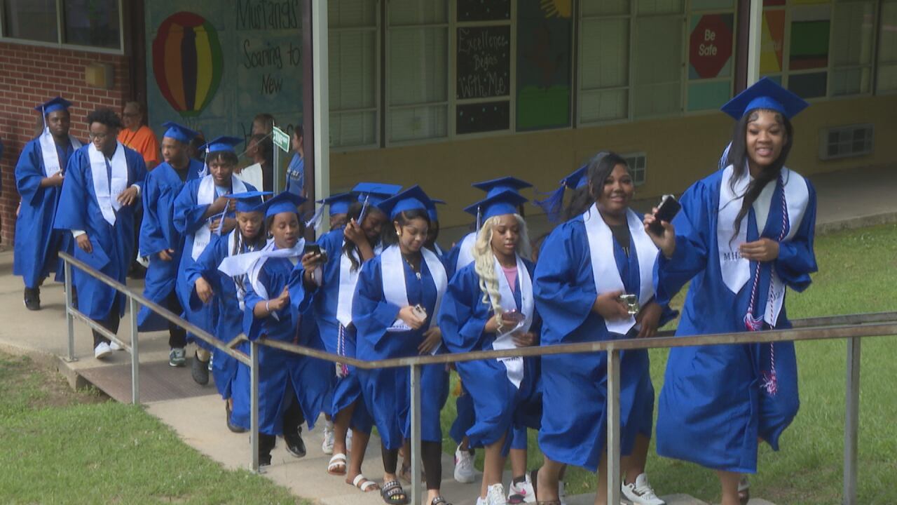 Meridian High School graduates participate in a “Senior Walk” at ...