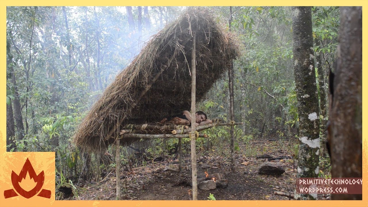 Making a primitive raised bed shelter from grass, vine, and wood