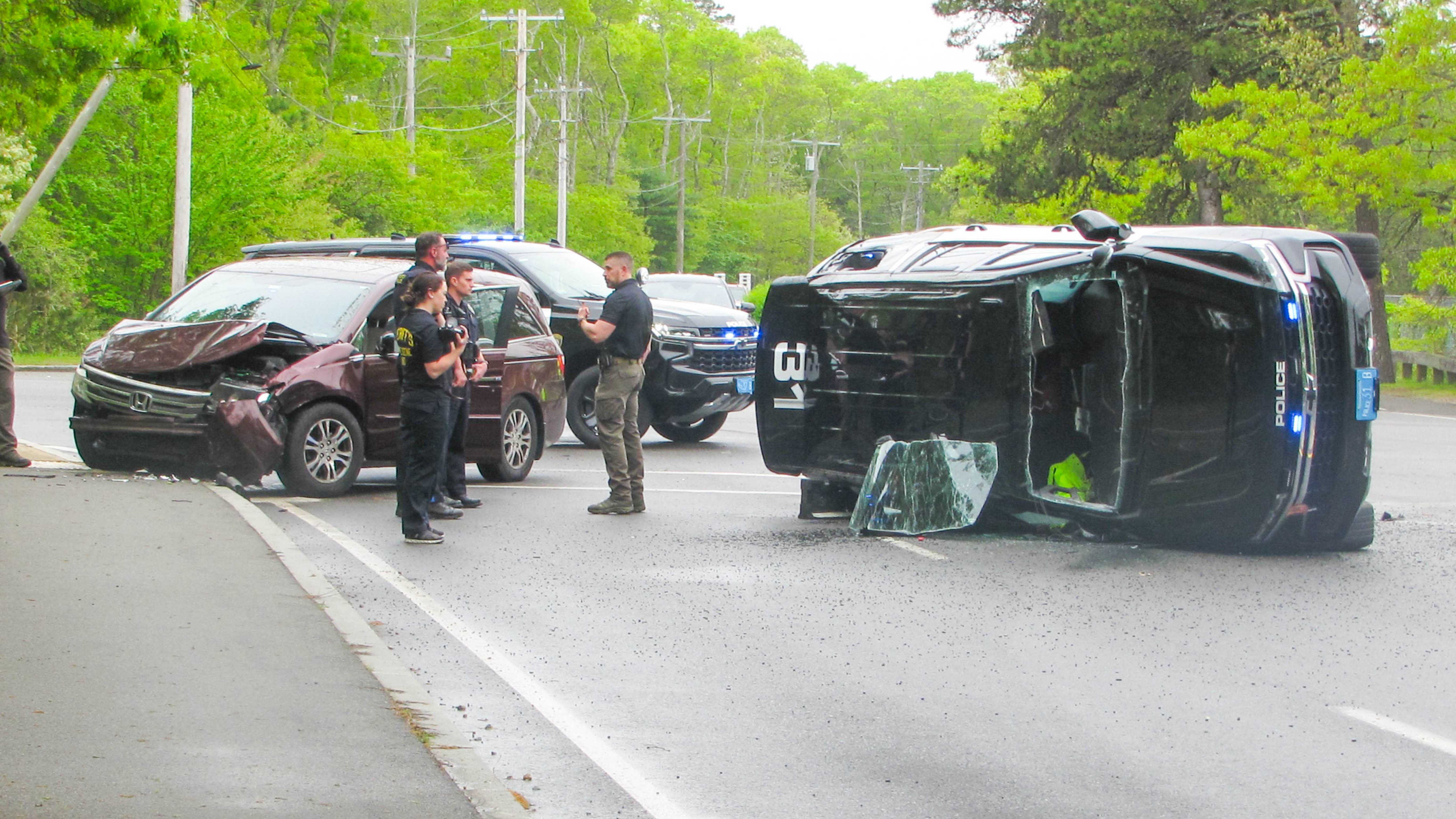Police officer hospitalized after rollover crash on Cape Cod