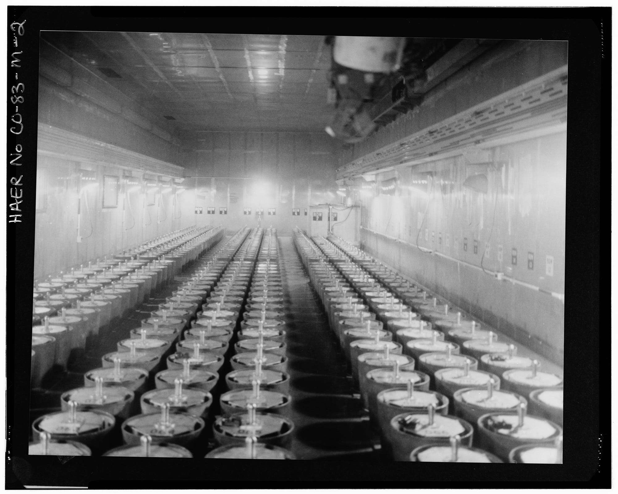 Archival images of Cold War nuclear weapons facilities.