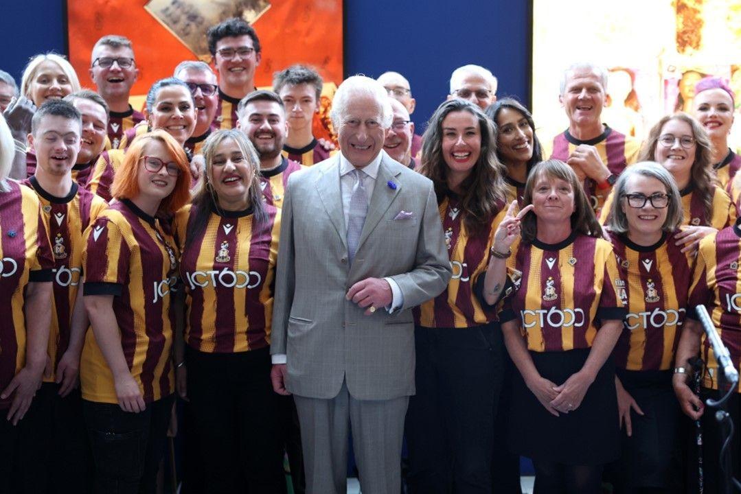 King Charles serenaded by Chris Kamara's Bantam of the Opera choir