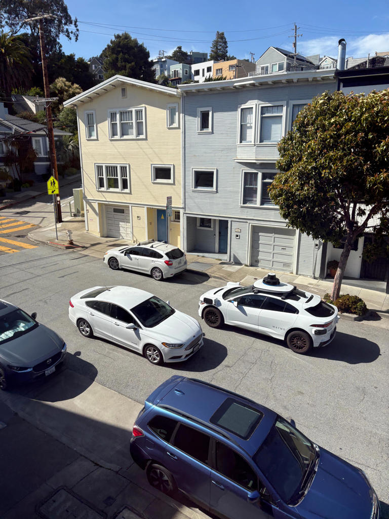 Seeking solitude and safety, riders flock to robotaxis driven by computers