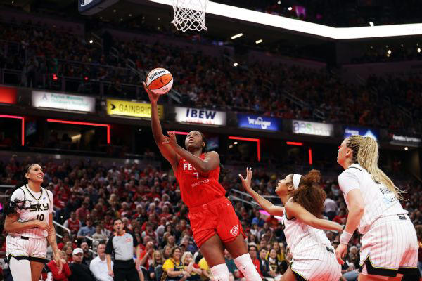 Caitlin Clark's triple-double leads Fever past Sky in opener