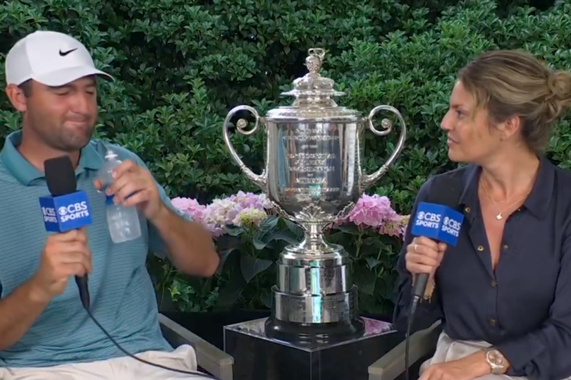 Scottie Scheffler reaches for water as Amanda Balionis interview goes ...