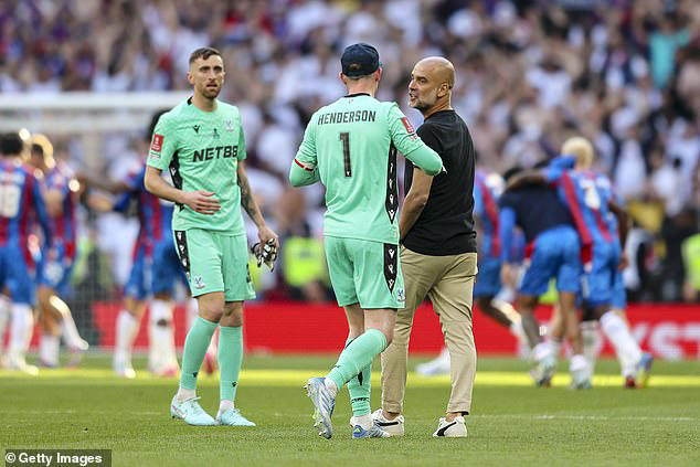 Pep Guardiola cuts a dejected figure after FA Cup final loss