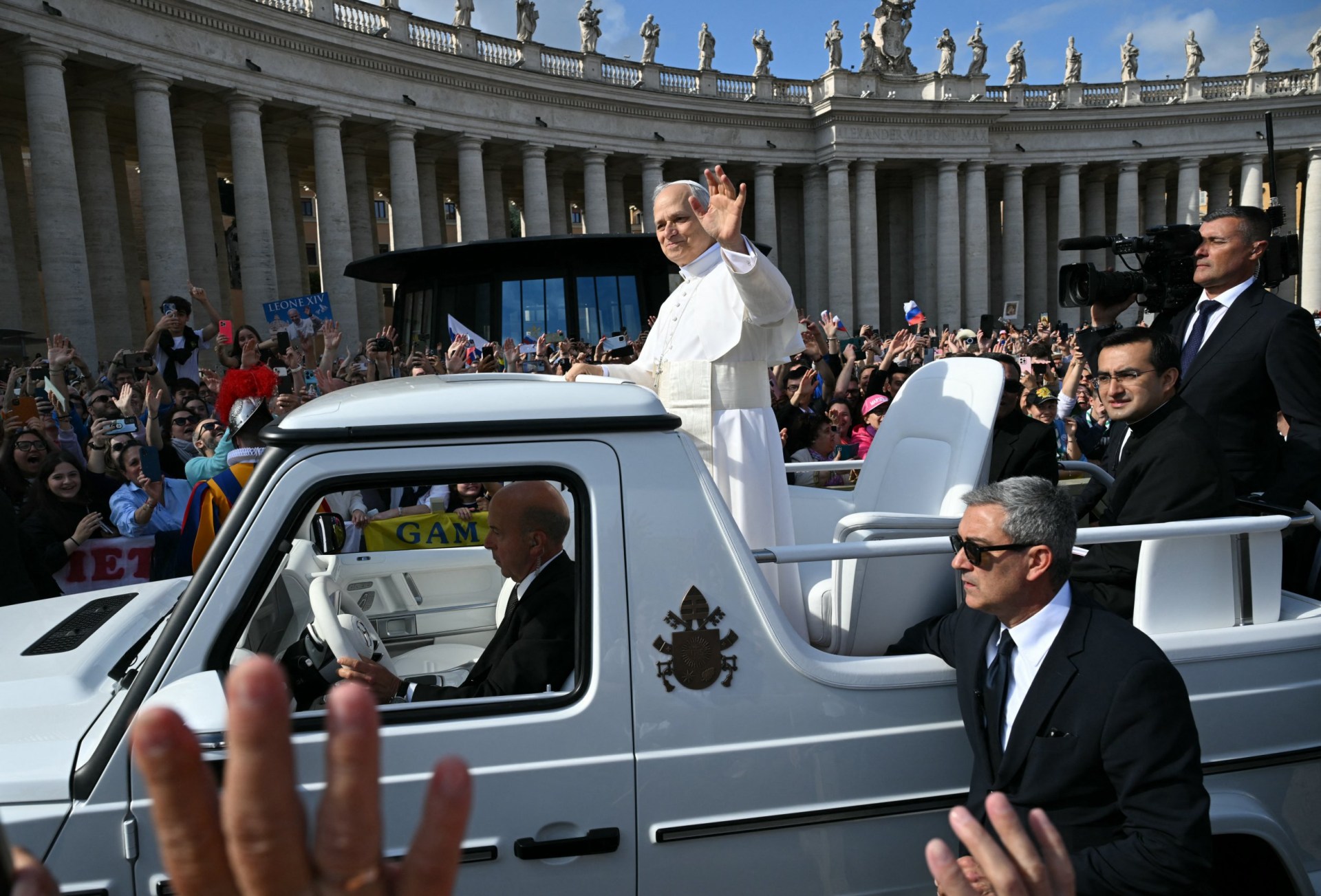 Pope Leo waves during first popemobile ride for inauguration in Vatican