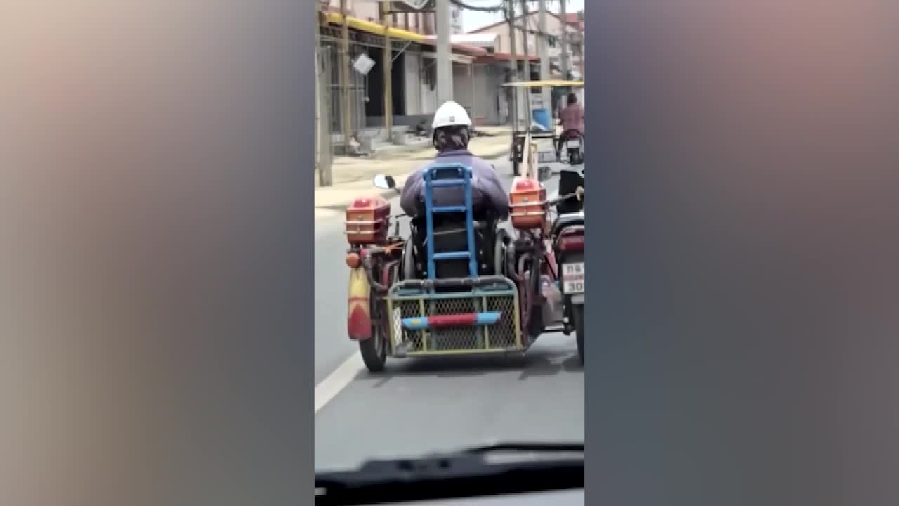 Disabled motorcycle rider modifies vehicle to control it while sitting ...