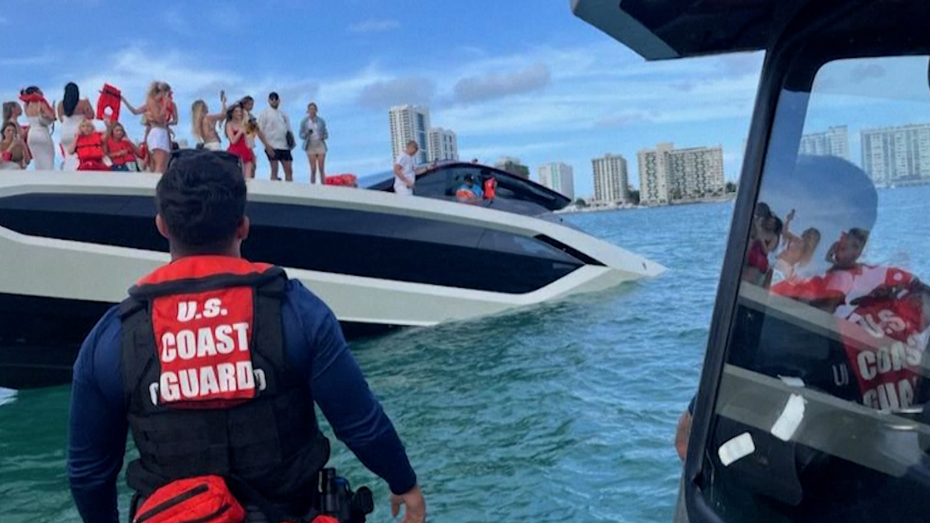 Coast Guard rescues 32 people from overloaded sinking yacht off Miami Beach